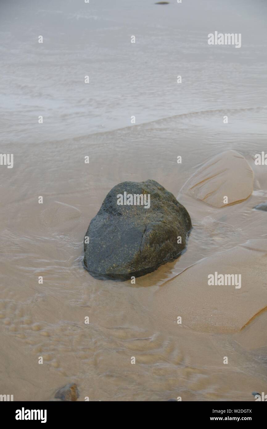Rounded boulder on a beach hi-res stock photography and images - Alamy