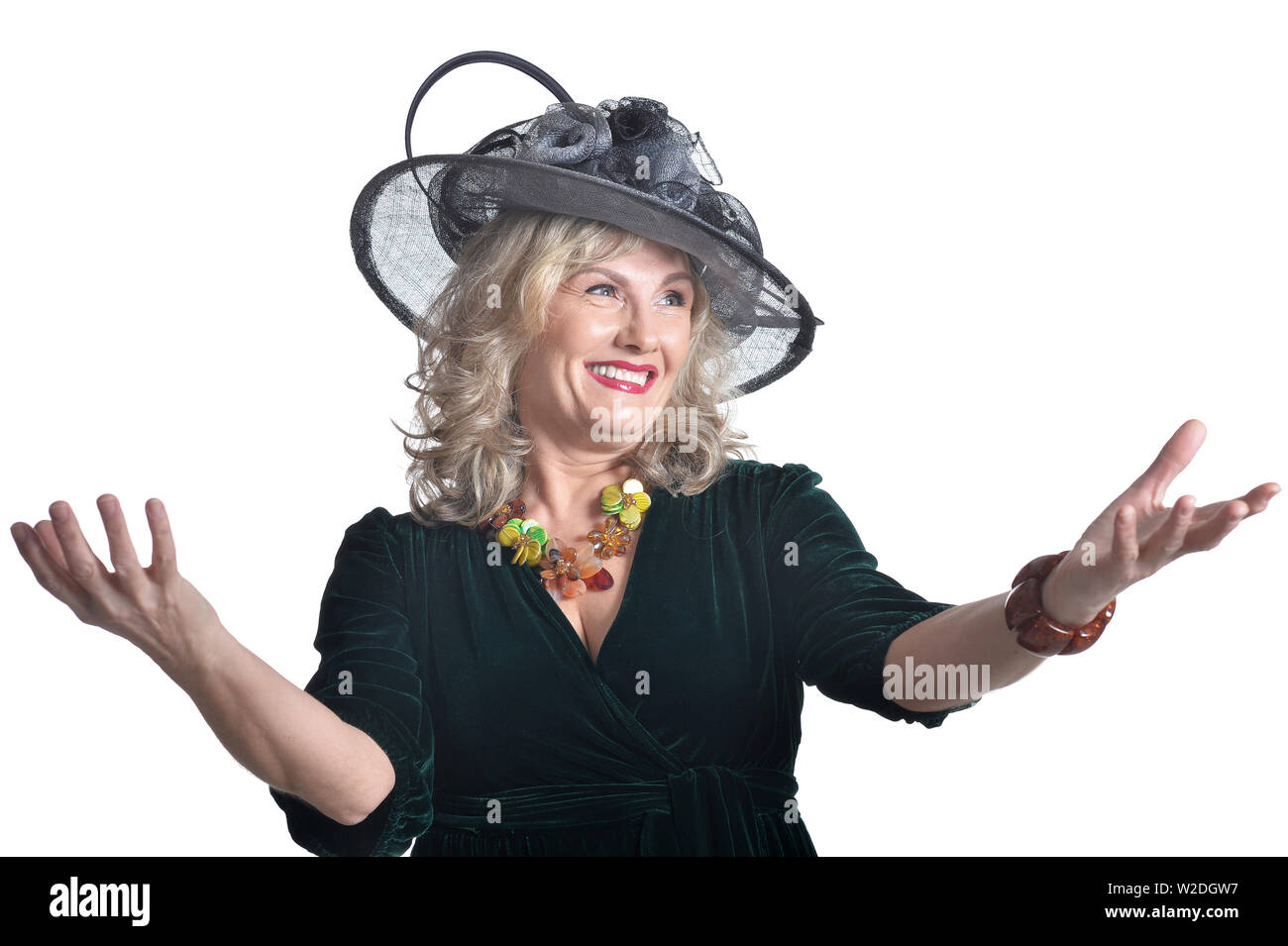 Senior woman wearing black hat isolated on white background Stock Photo ...