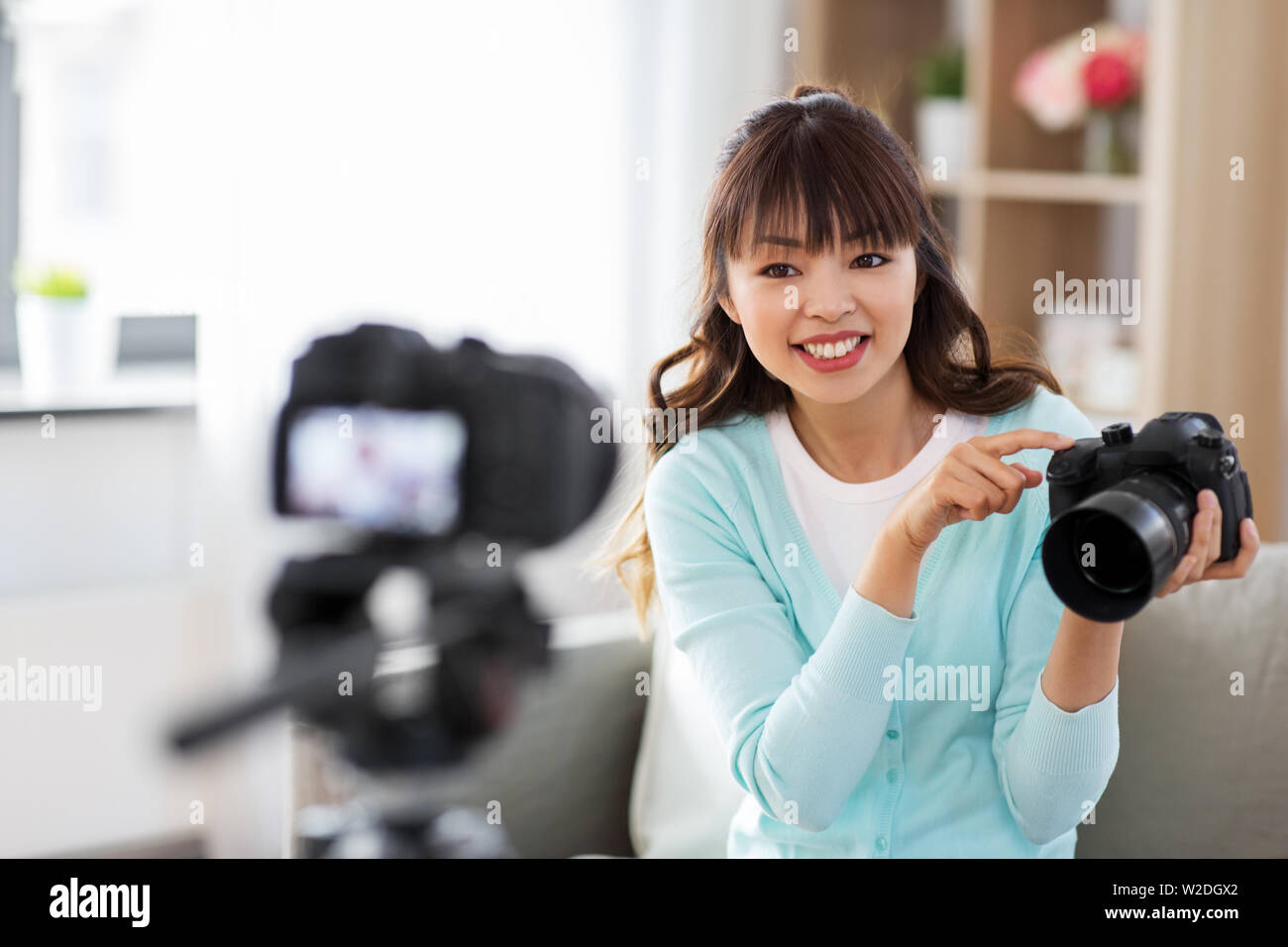 asian female blogger with camera recording video Stock Photo - Alamy