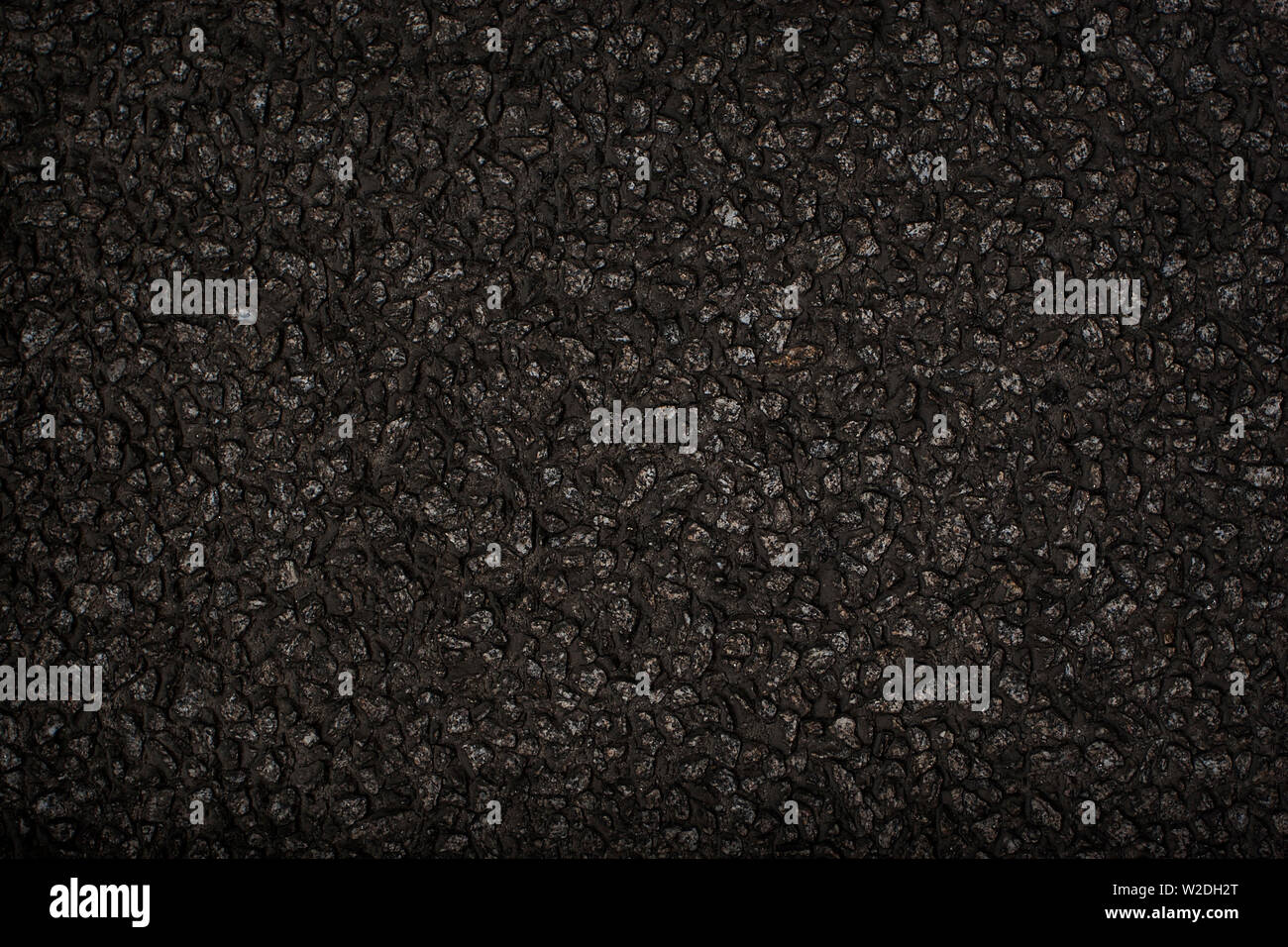 Close up of the coarse surface texture of a tarmac road Stock Photo - Alamy