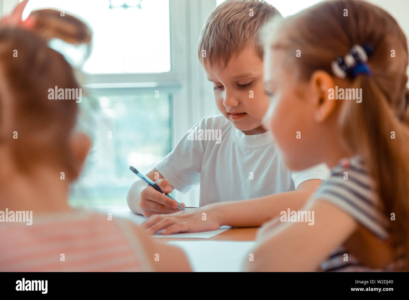 Happy diligent kids drawing hi-res stock photography and images - Alamy