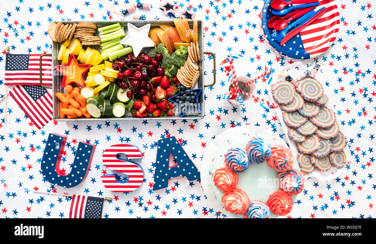 Flat lay. Snack tray with fresh fruits, vegetables, and dips at the ...