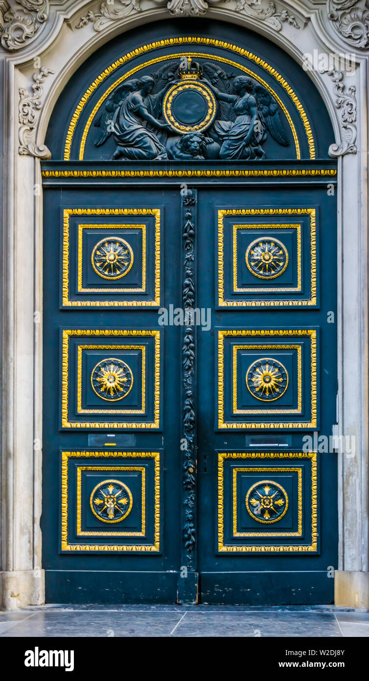 Old classic doorway decorated with gold and patterns, angel statues ...