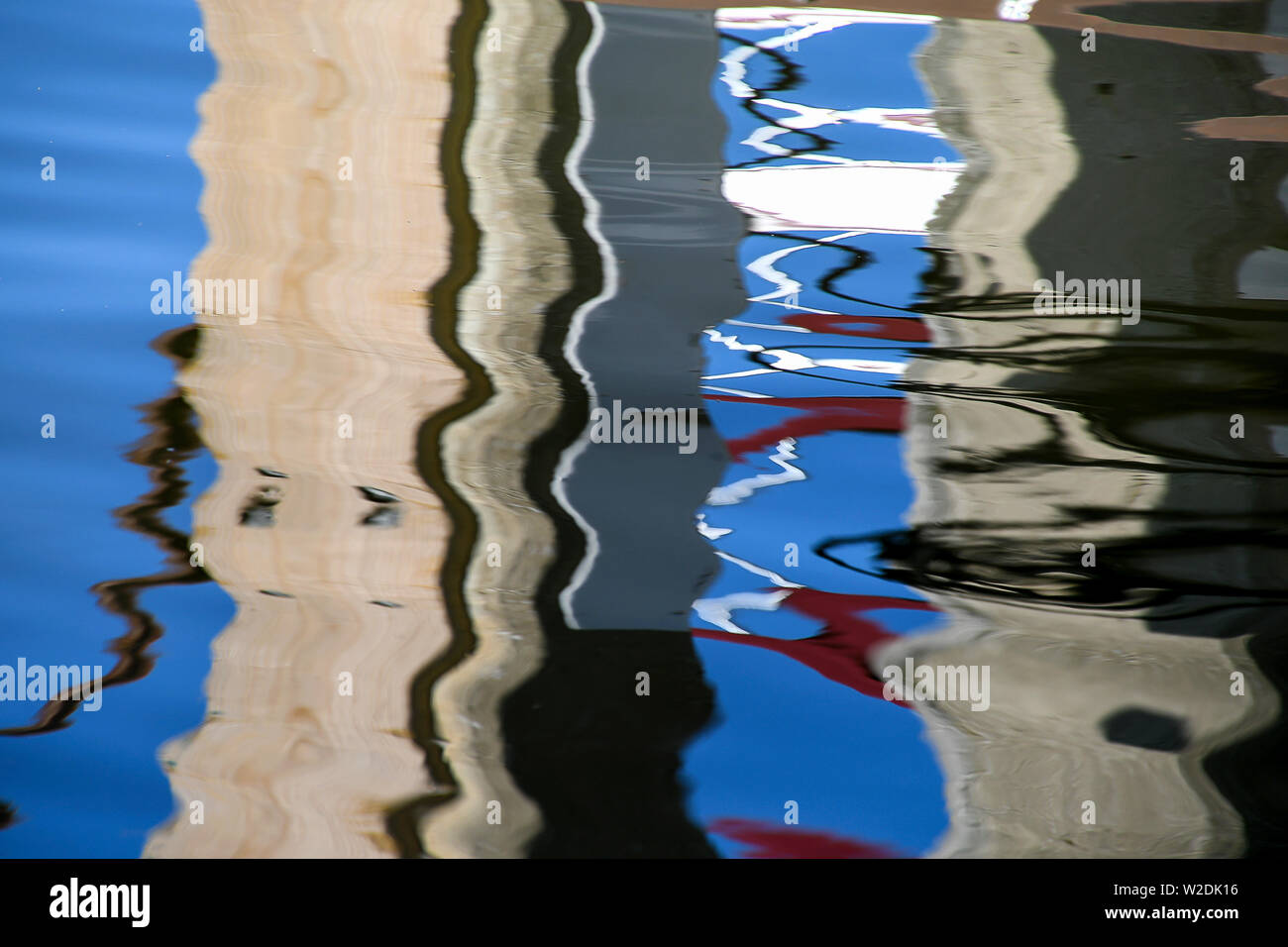 concrete dock piling in abstract wavy water reflection pattern Stock ...