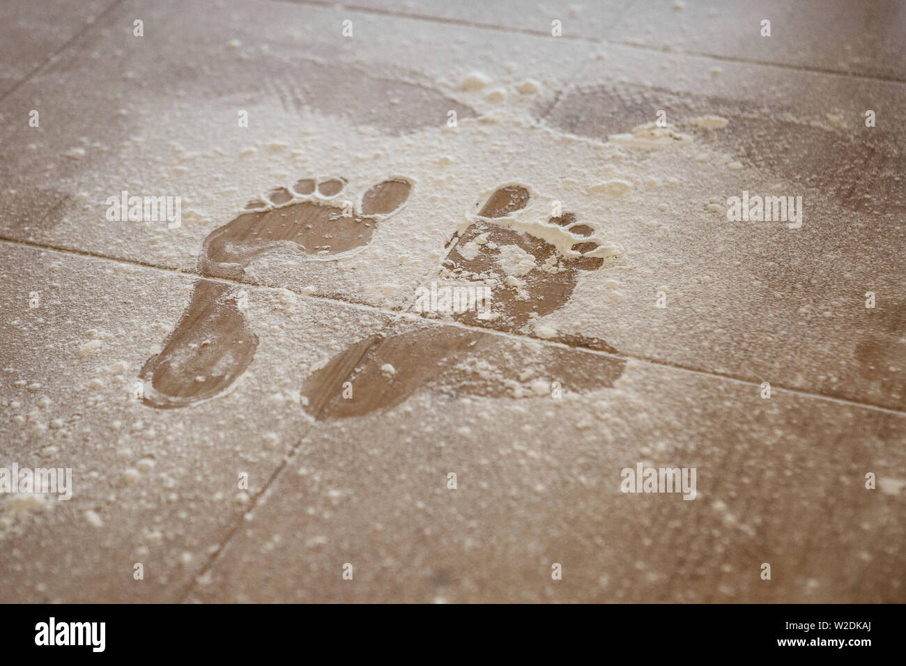 Foot print on flour on the floor. The process of cooking or sprinkled ...