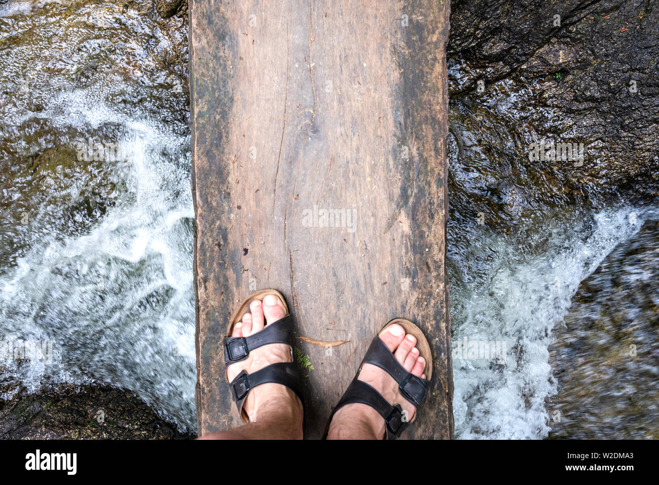 a dangerous bridge of wooden boards on a river Stock Photo - Alamy
