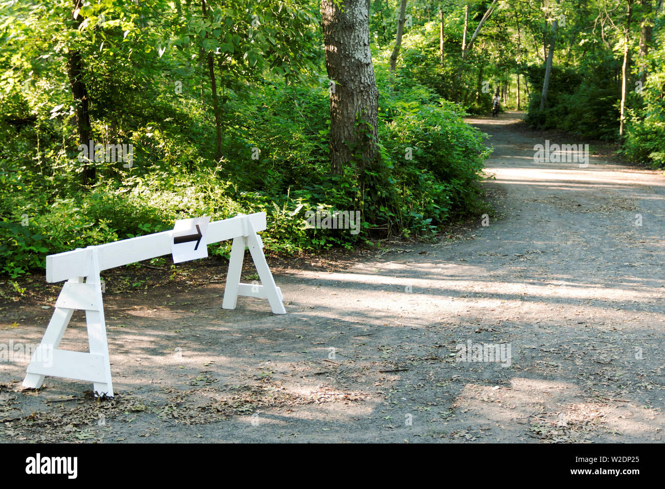 An arrow is taped onto a white wooden barrier showing the runners of a ...