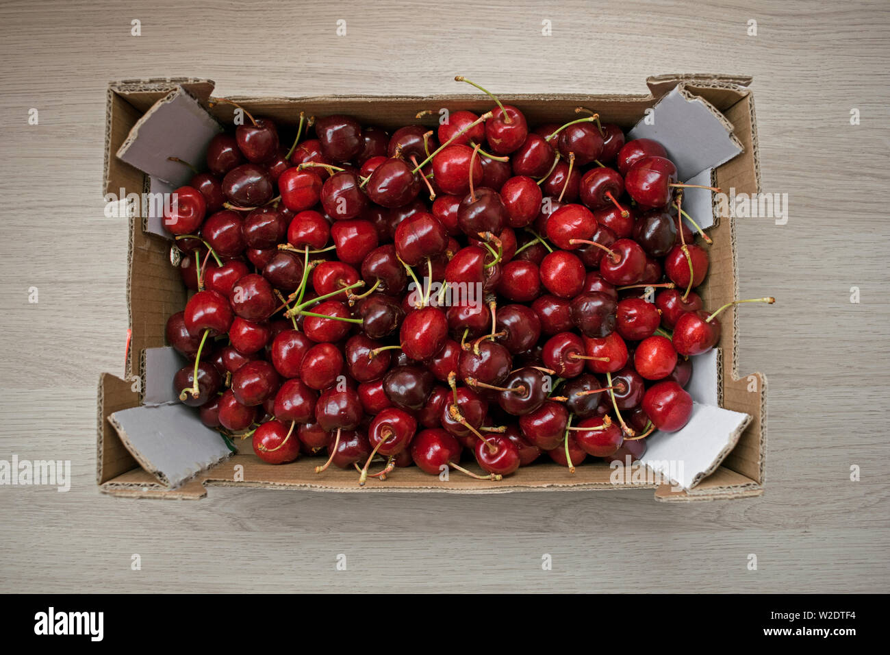 Top view of a box with delicious ripe cherries Stock Photo - Alamy