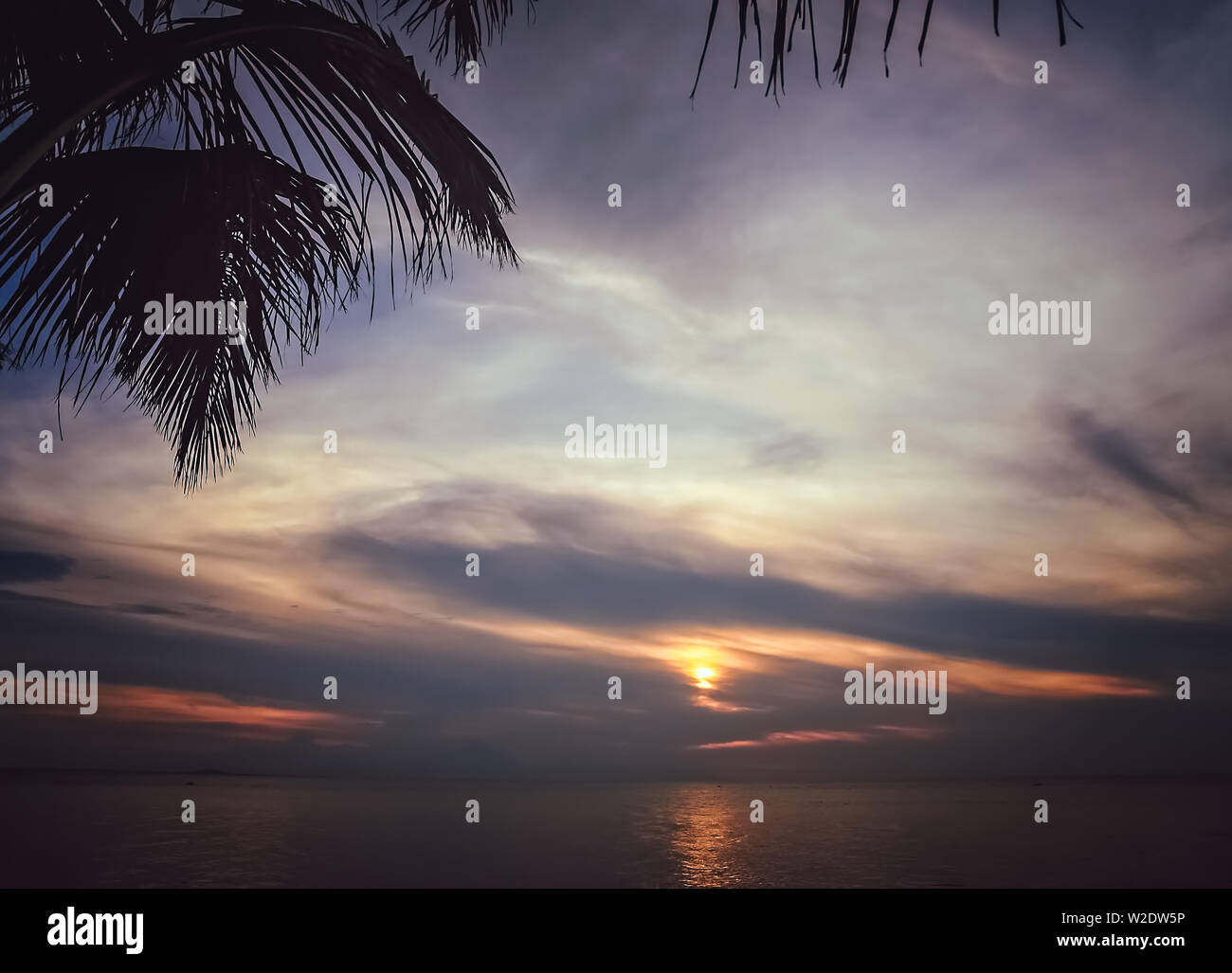 Sunset over the ocean as seen from the beach in Bali, Indonesia, Asia ...