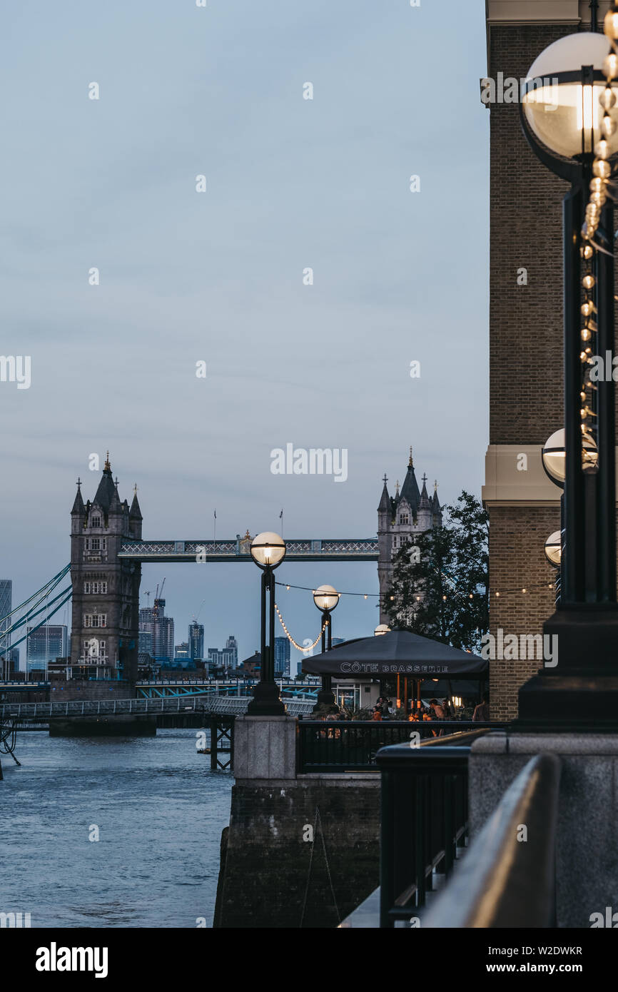 London, UK - June 22, 2019: Street lights illuminated on a walkway ...