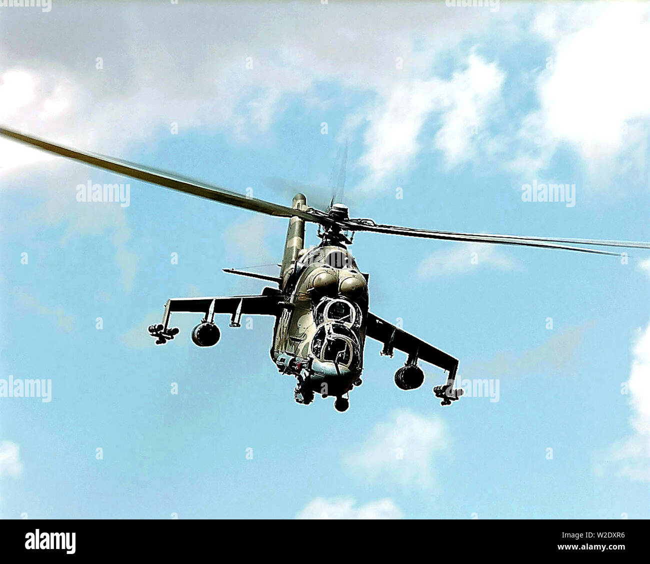 A Mi-24 "Hind" helicopter simulates an attack while being scoped by a ...