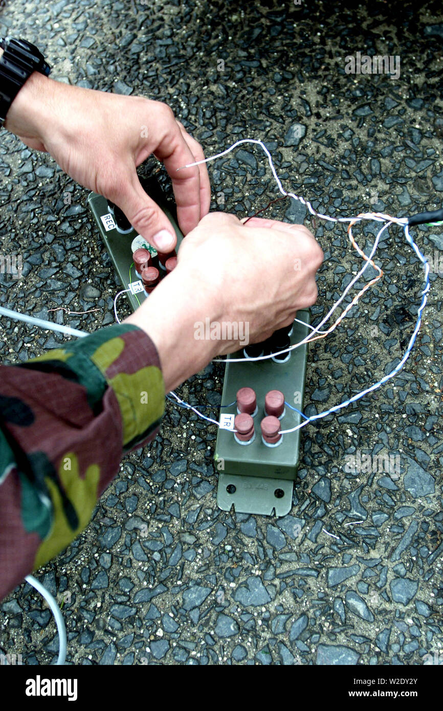 Wires to a junction box are connected prior to a transmission test ...