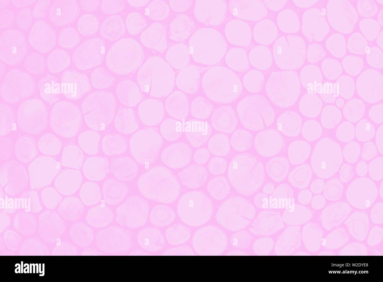 Light pink round pattern on a deep pink background. Wooden texture ...