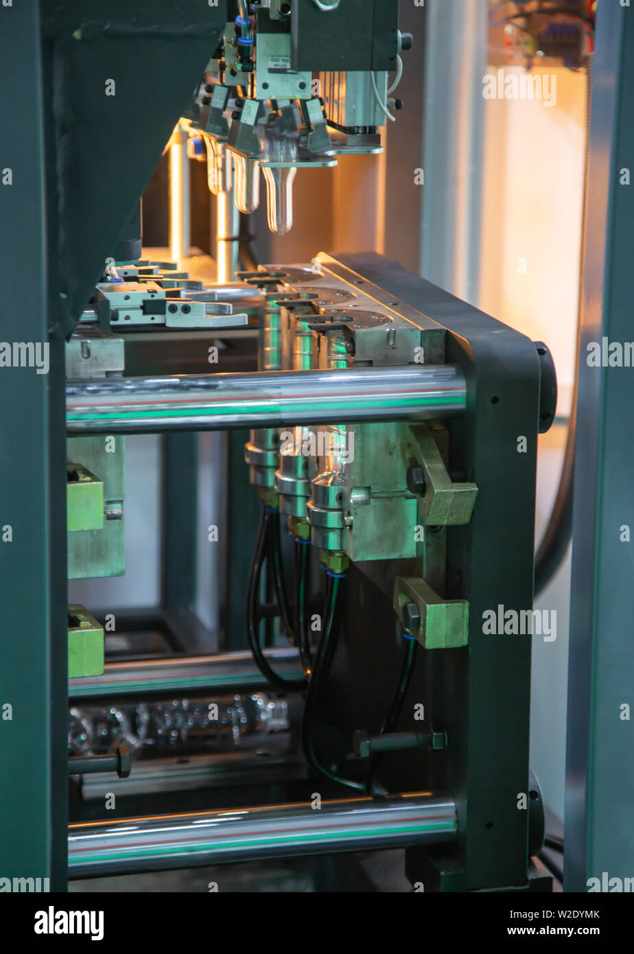 Process of PET plastic bottle on plastic Bottle blowing machine Stock ...