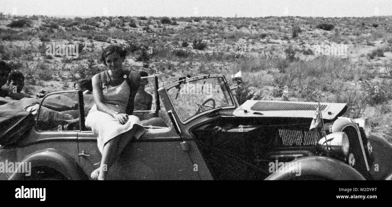 Eva Braun Collection (album 4) - woman sitting atop a car stuck in sand ...