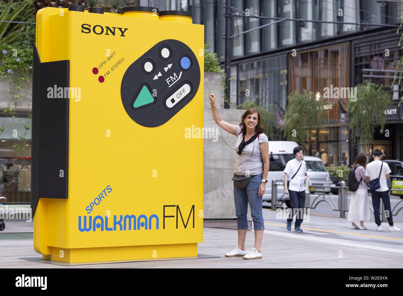 Tokyo, Japan. 8th July, 2019. A woman tries to plugin to a huge ...