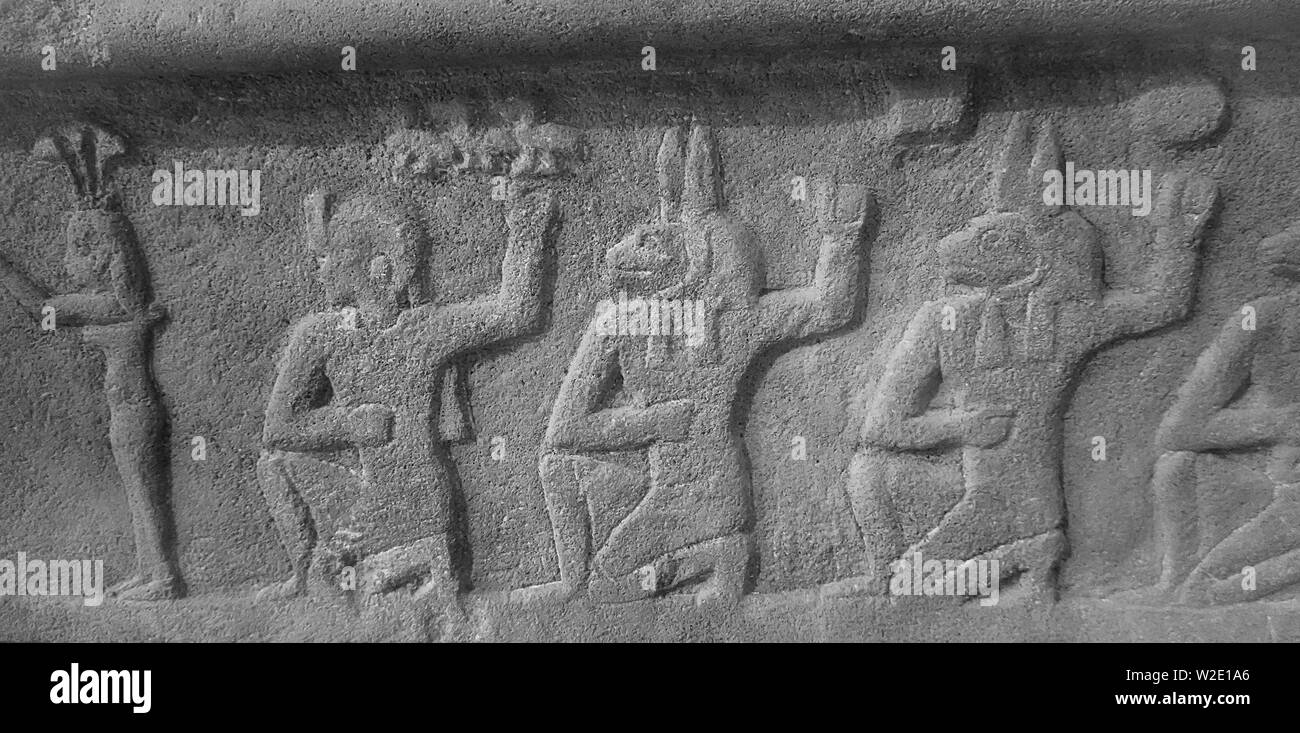 Wall relief on a temple near a pyramid in Sudan with the dog-headed god ...