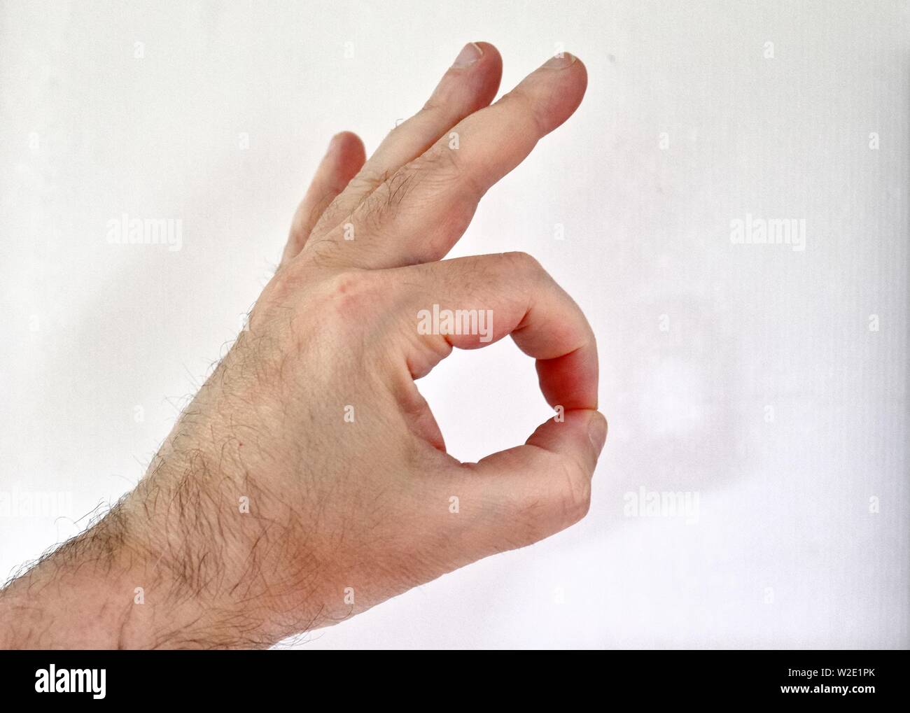 Male human hand showing different gestures and symbols Stock Photo - Alamy