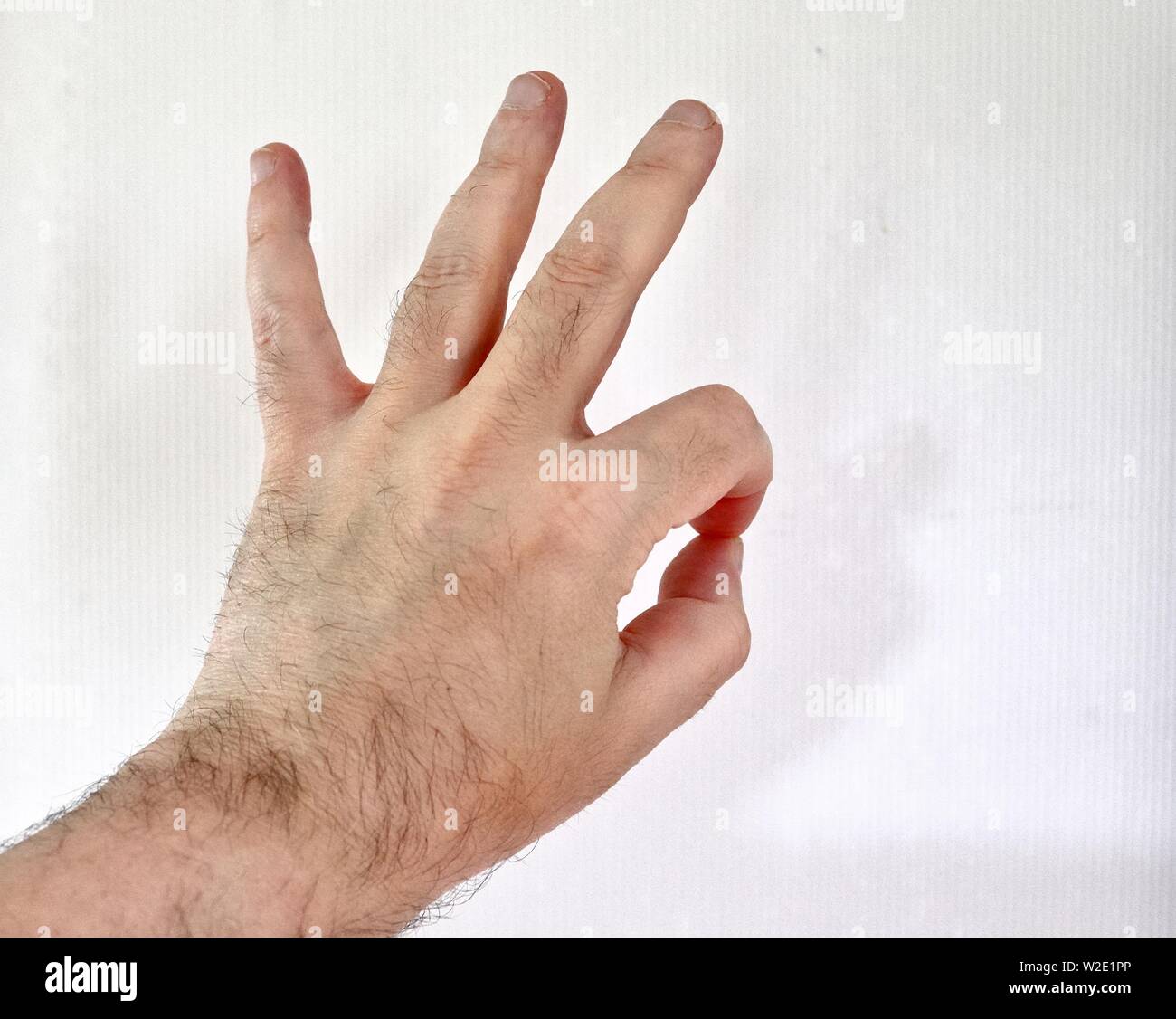 Male human hand showing different gestures and symbols Stock Photo - Alamy