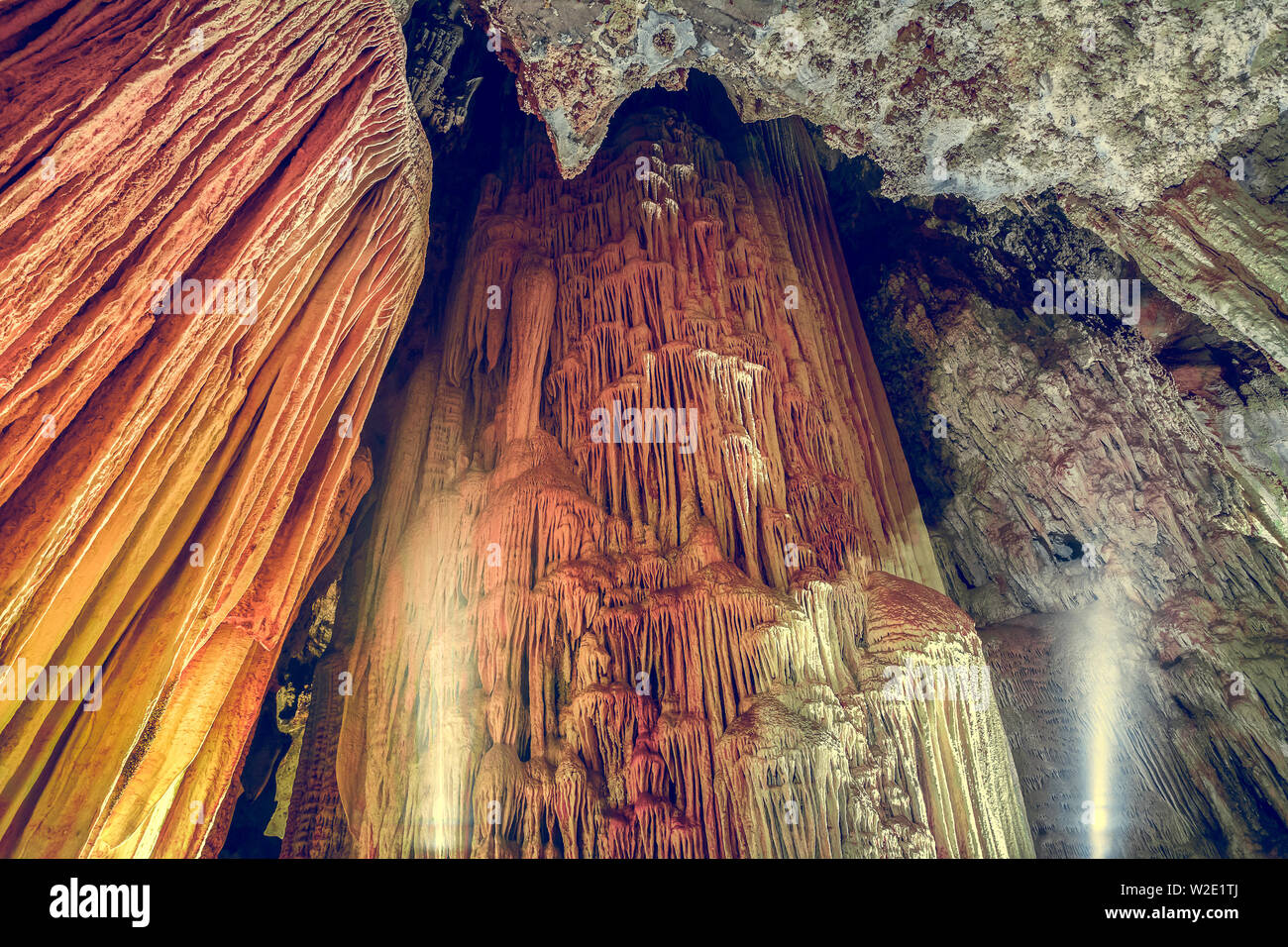Cave colorful stalactites and stalagmites Stock Photo - Alamy