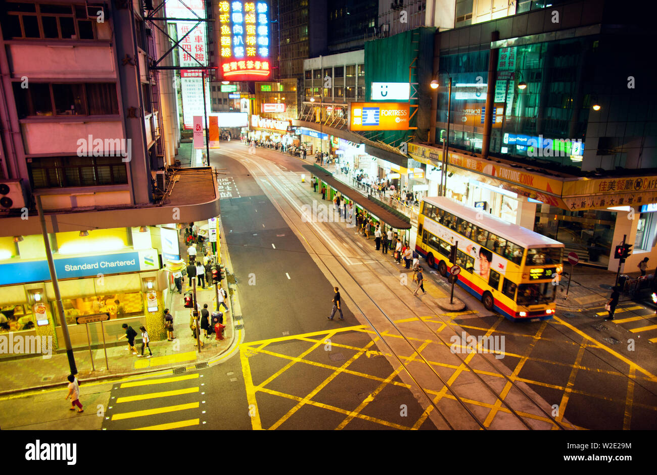 Traffic in an urban street at night Stock Photo - Alamy