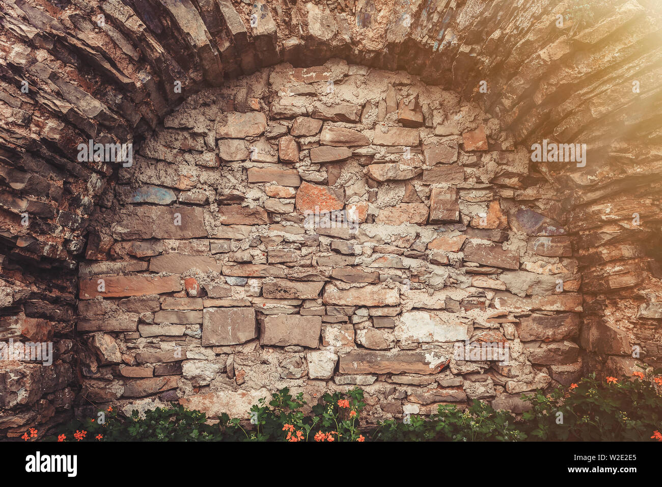 Ancient stone wall with arched niche Stock Photo - Alamy