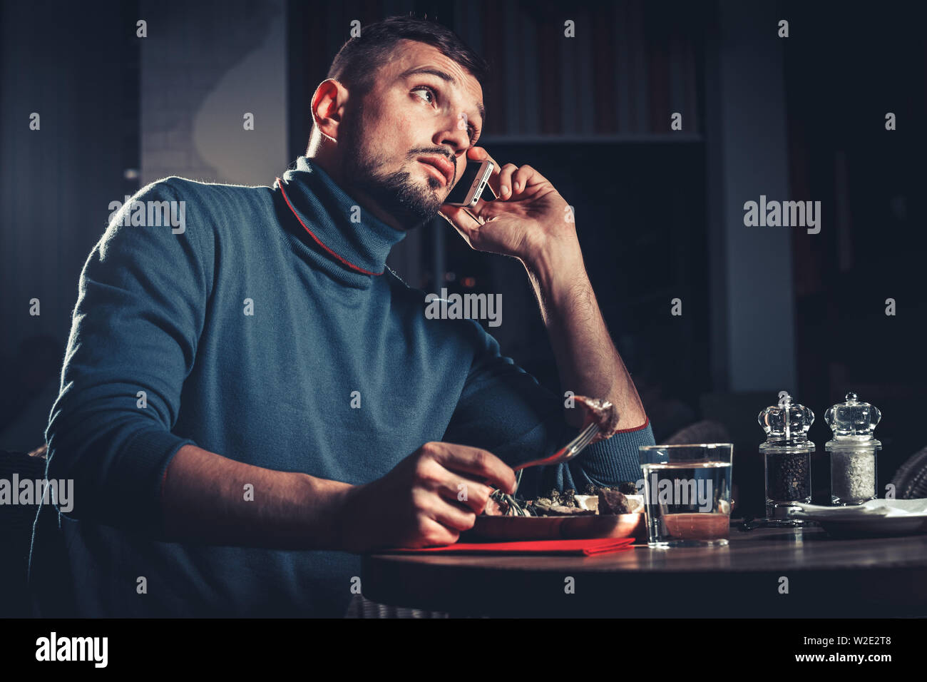 Handsome guy eating hi-res stock photography and images - Alamy