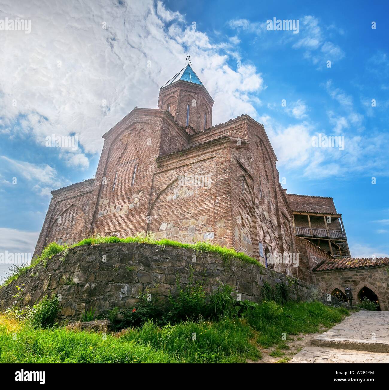 beautiful old Church in Georgia against blue sky with white clouds ...