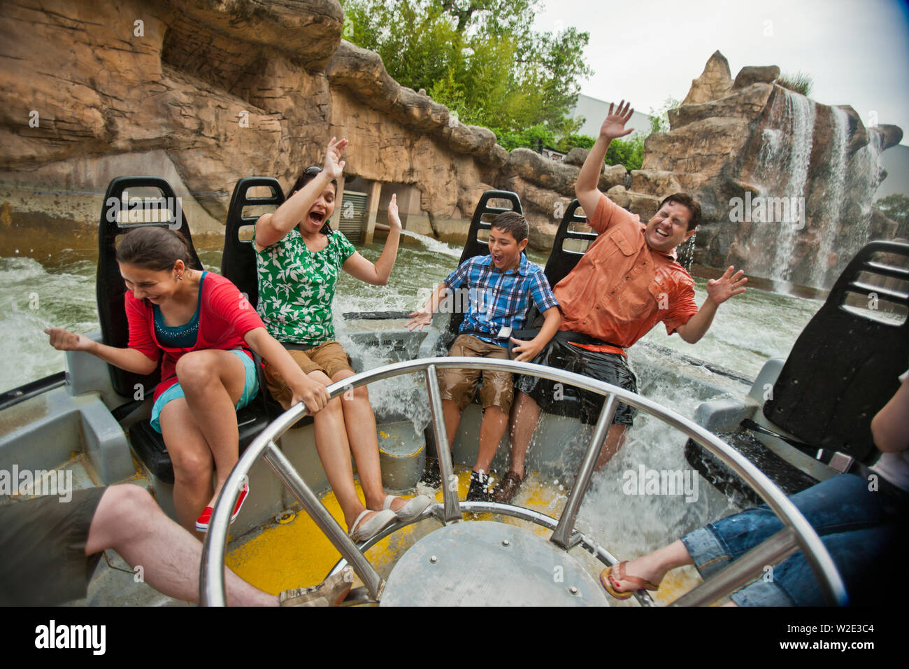Happy family child riding water hi-res stock photography and images - Alamy