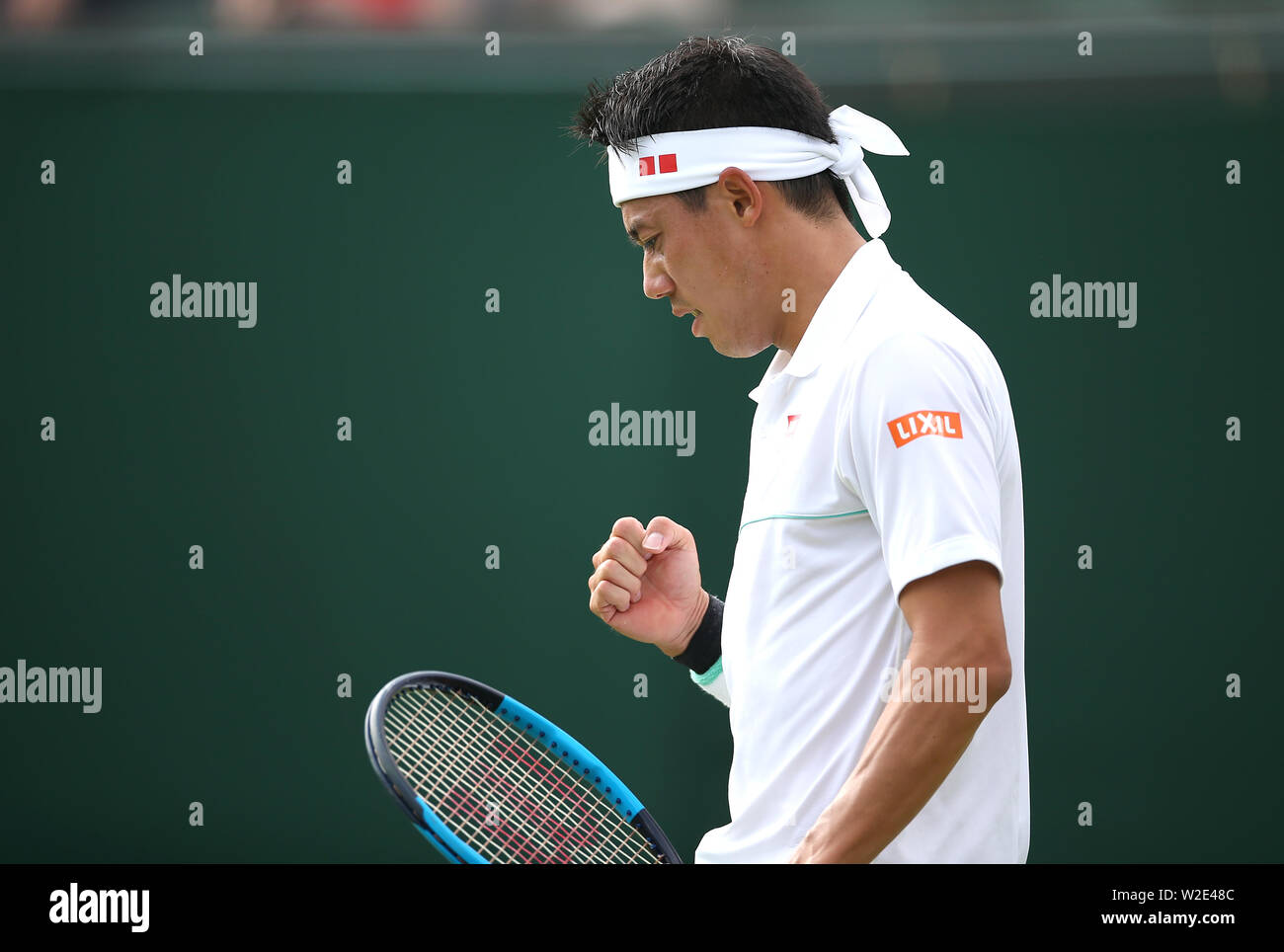 Kei Nishikori celebrates winning the first set during his round of 16 ...