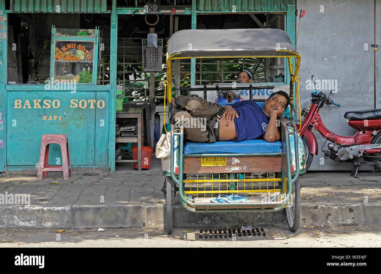 yogyakarta, di yogyakarta/indonesia - november 10, 2015: a becak driver ...