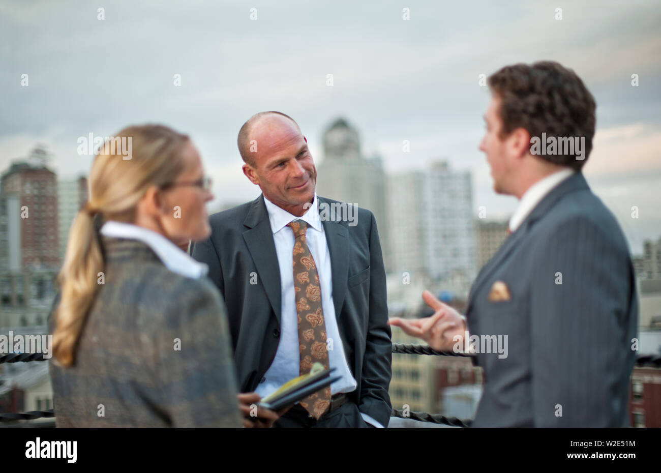 Eager young man makes a business proposal to his boss as they relax on ...
