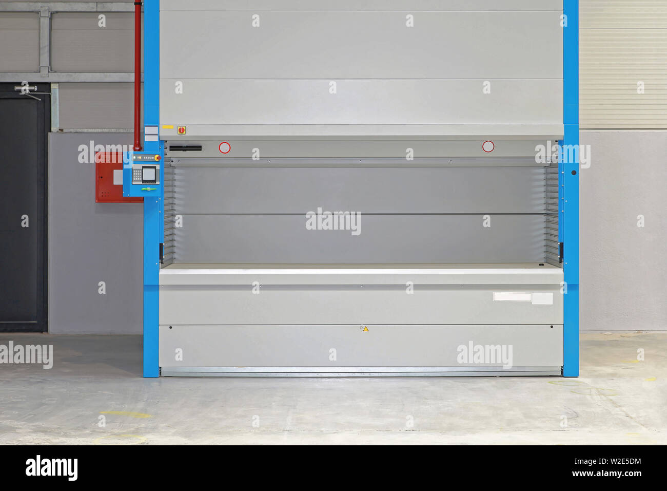 Empty Automated Carousel Storage Shelf in Warehouse Stock Photo - Alamy