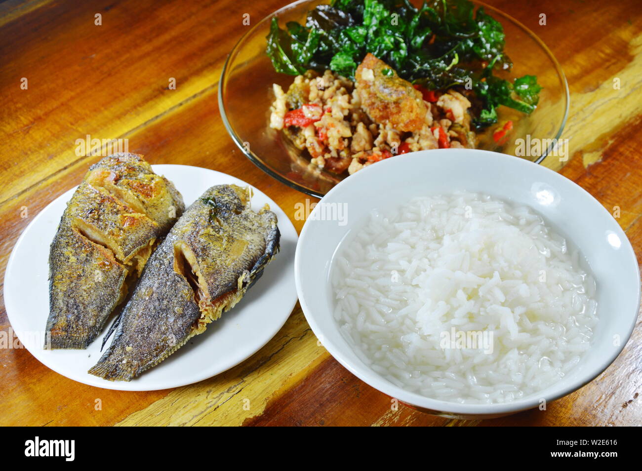 rice porridge eat with stir fried crispy basil leaf with black ...