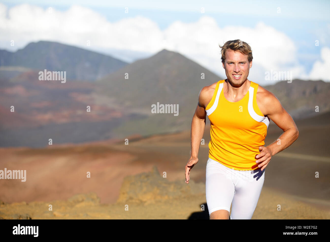 Running athlete - man runner sprinting fast. Male sport fitness model ...