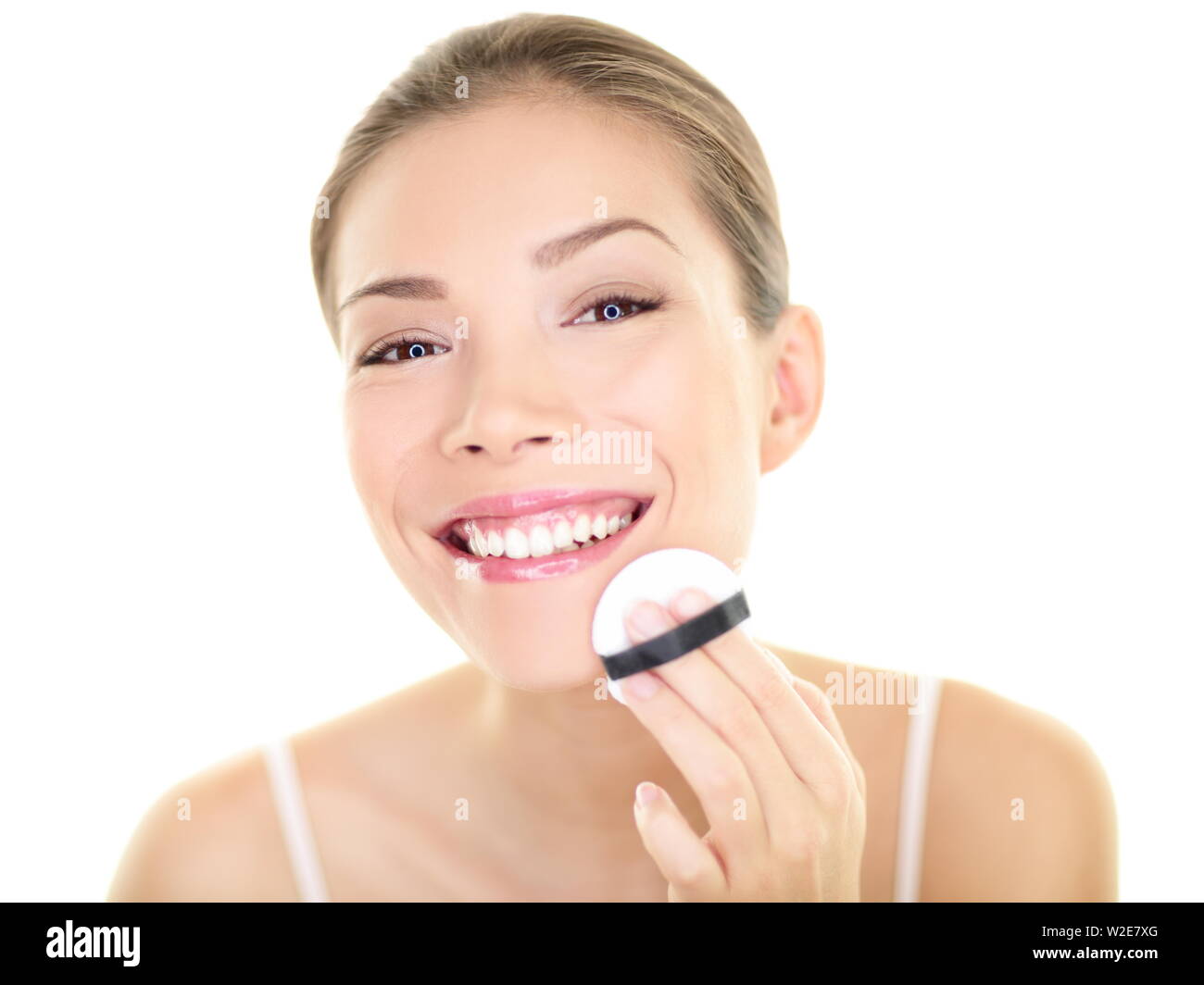 Woman applying make up to cheek hi-res stock photography and images - Alamy