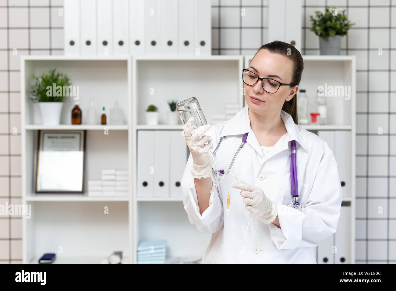 The nurse prepares a dropper with a solution of medicine Stock Photo ...