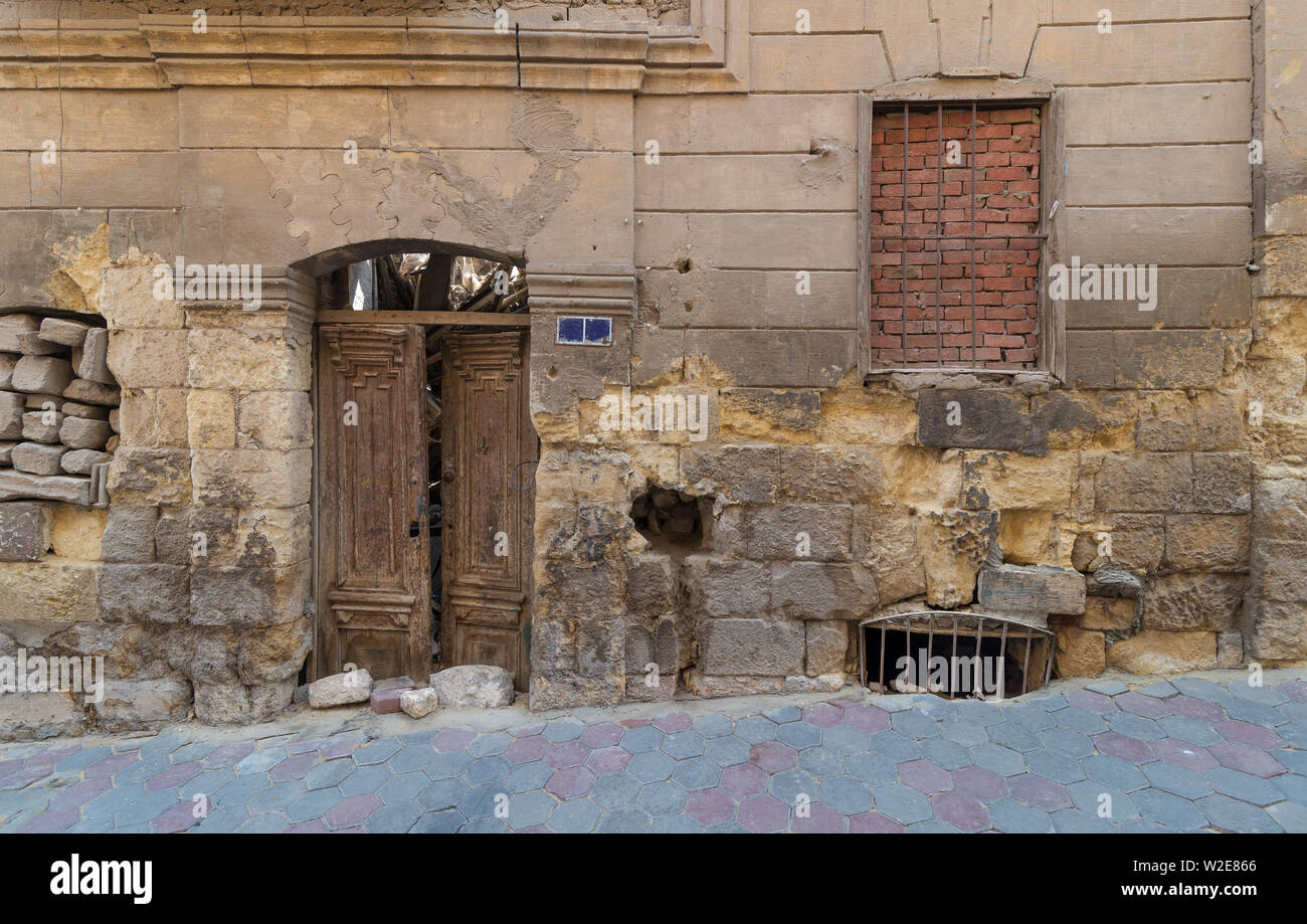 Grunge stone bricks wall with Broken wooden door and closed broken ...