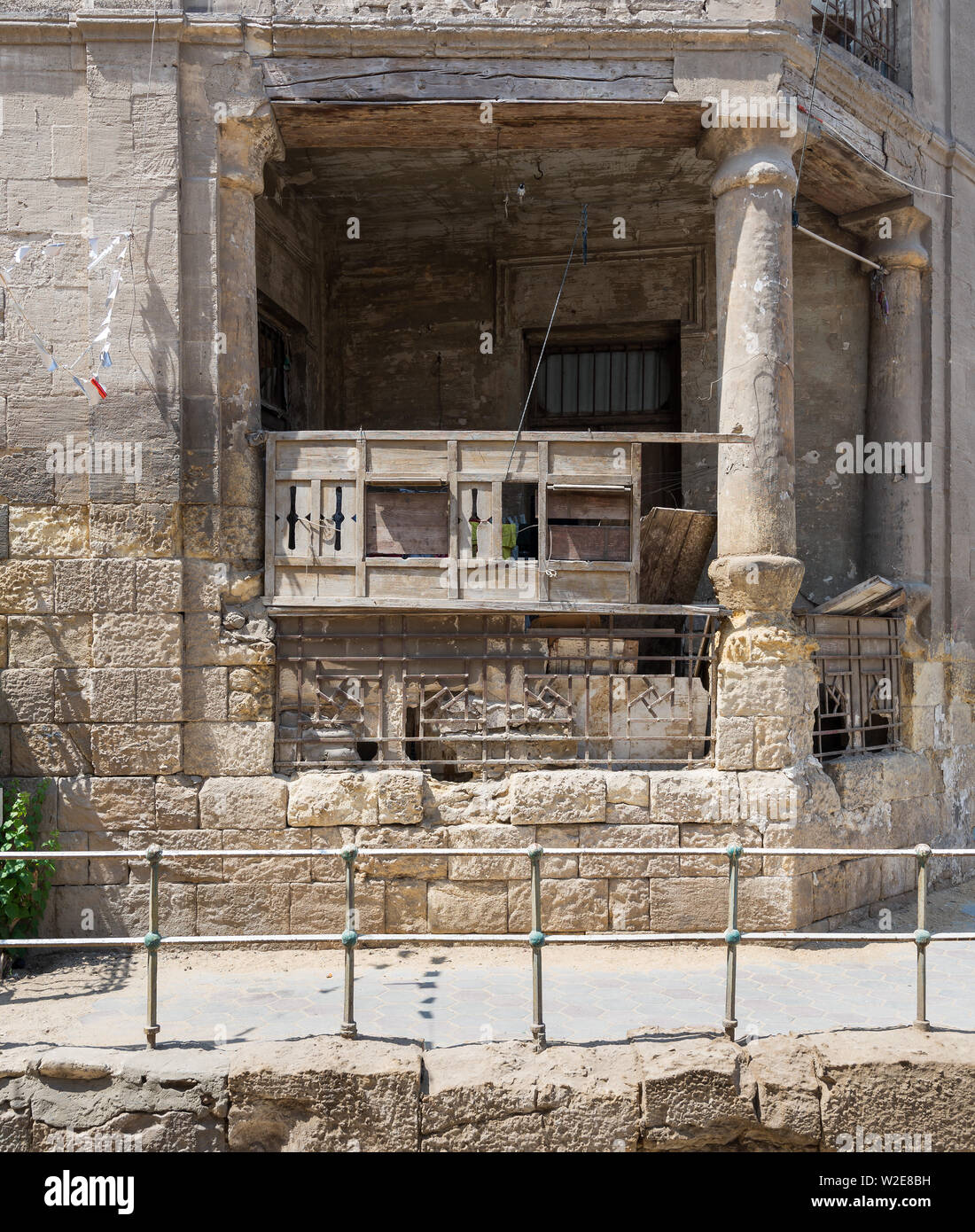 Facade of abandoned ruined grunge balcony, Darb El Labana district ...