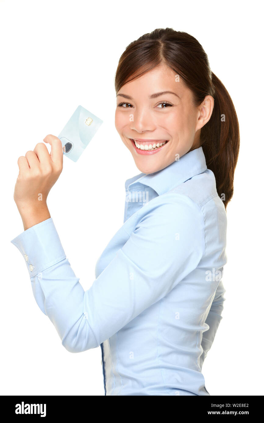 Casual business woman holding showing credit card smiling happy in blue ... Casual business woman holding showing credit card smiling happy in blue ...