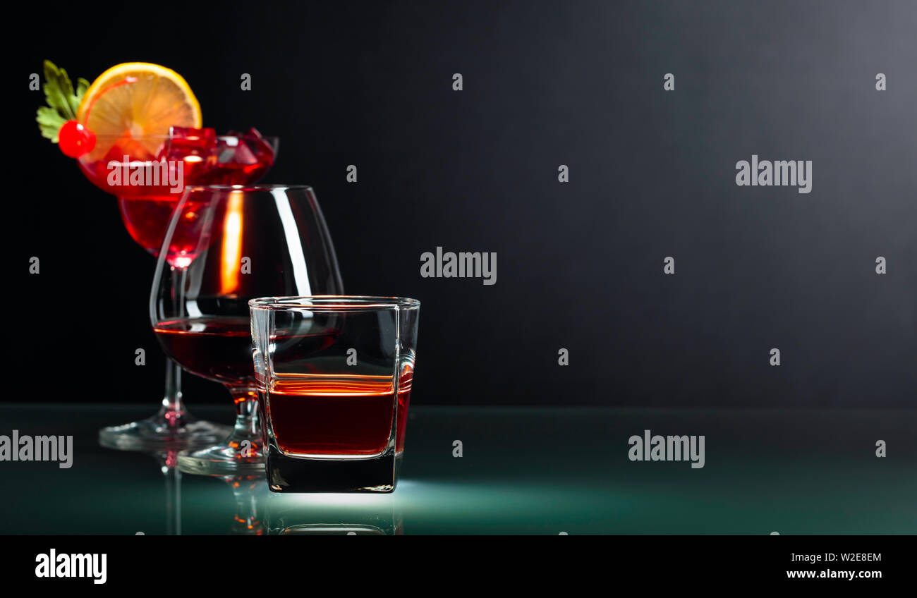 Various alcoholic drinks on a black background. Copy space Stock Photo ...