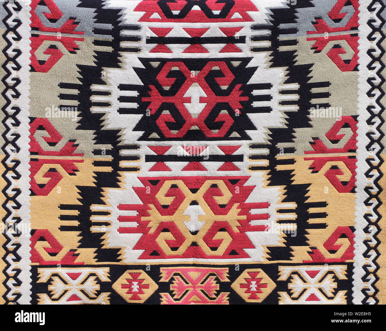 Texture of traditional turkish wool carpet with geometric pattern ...