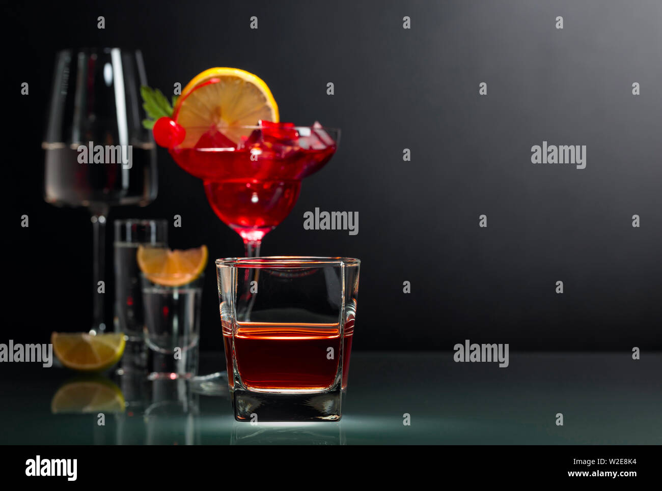Various alcoholic drinks on a black background. Copy space Stock Photo ...