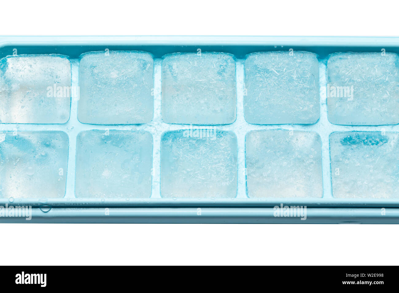 A blue plastic ice cube tray with frost Stock Photo - Alamy