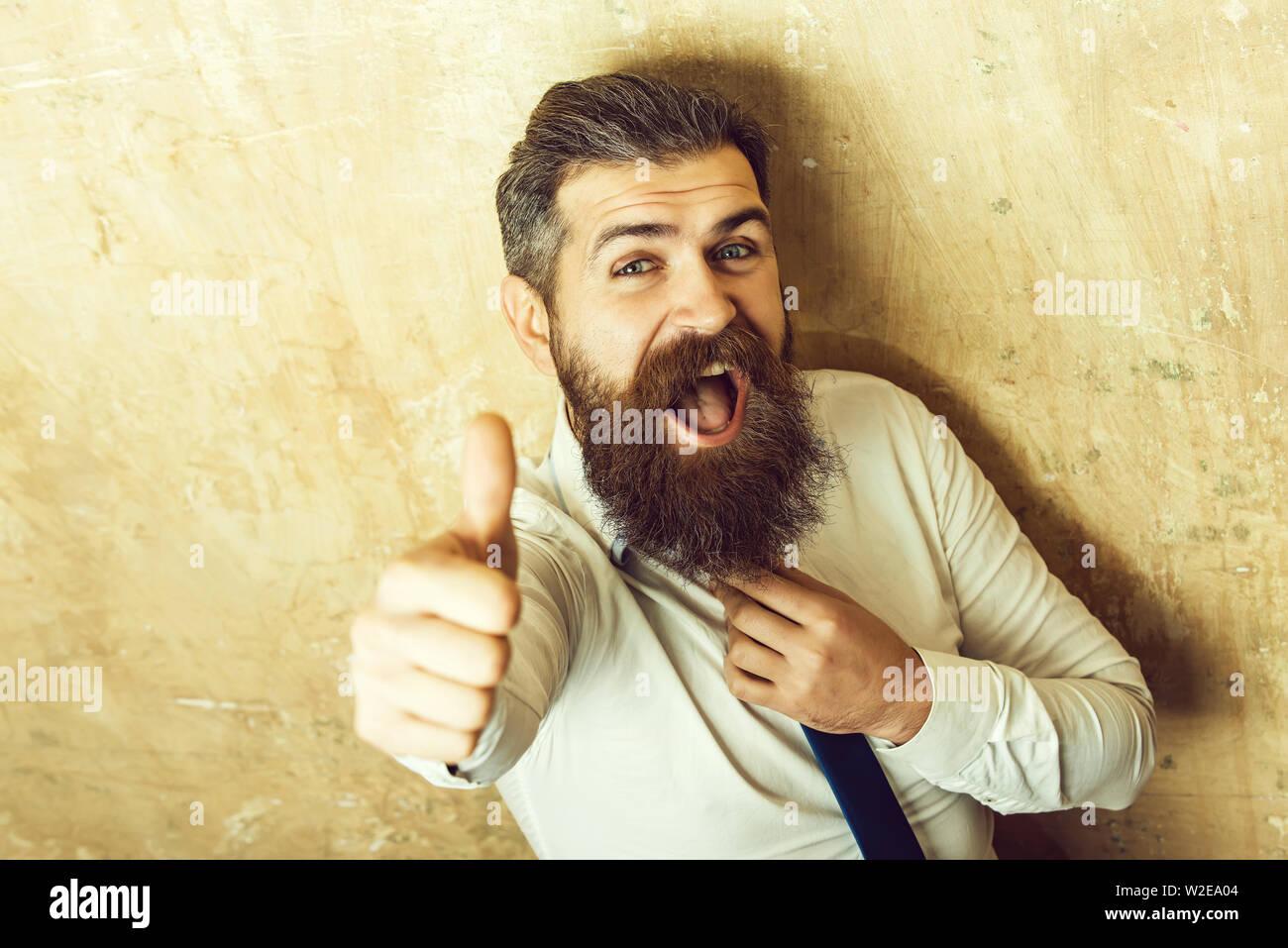 thumb up gesture of bearded man or hipster with long beard and stylish ...