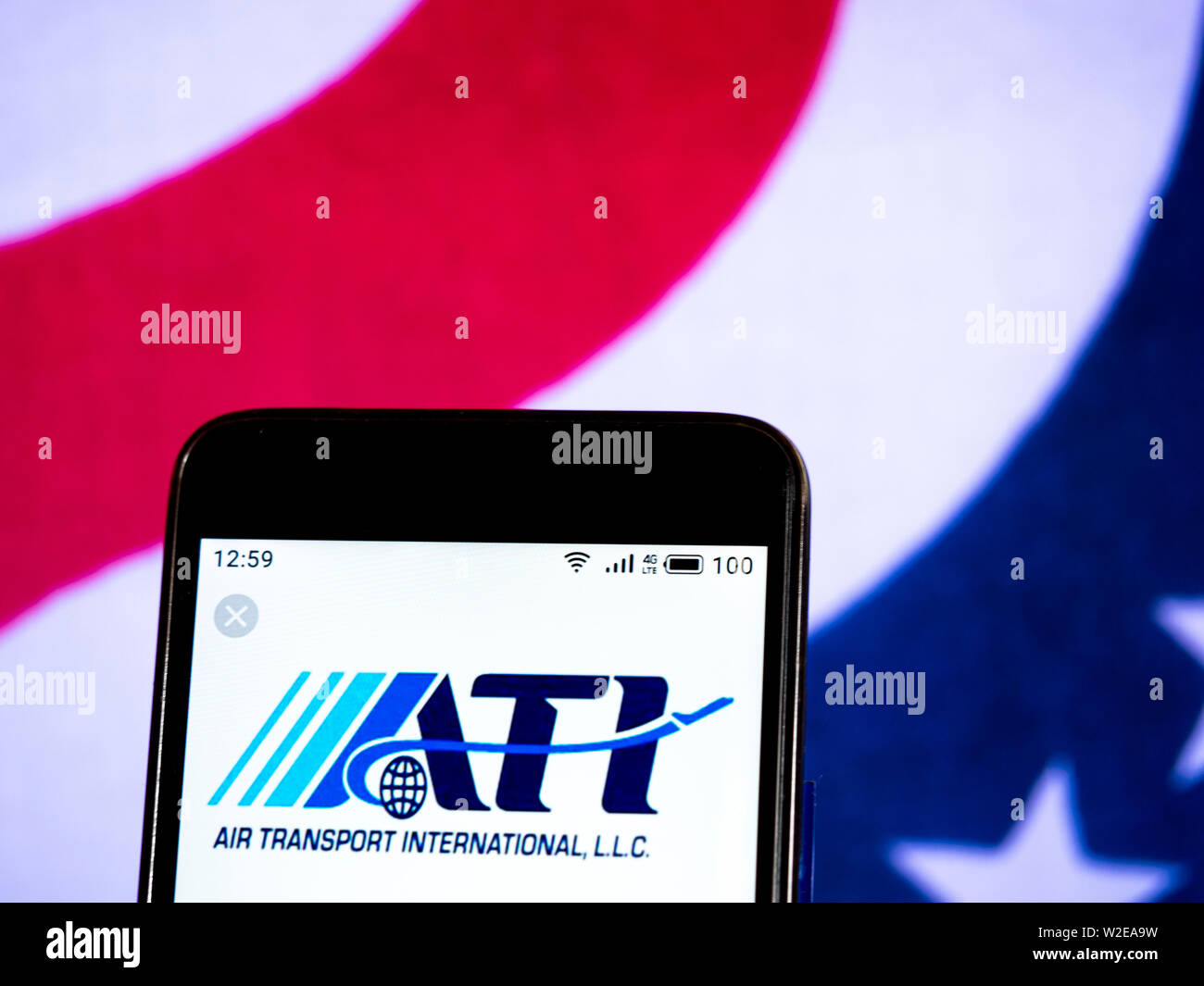 In this photo illustration the Air Transport International, Inc. logo ...