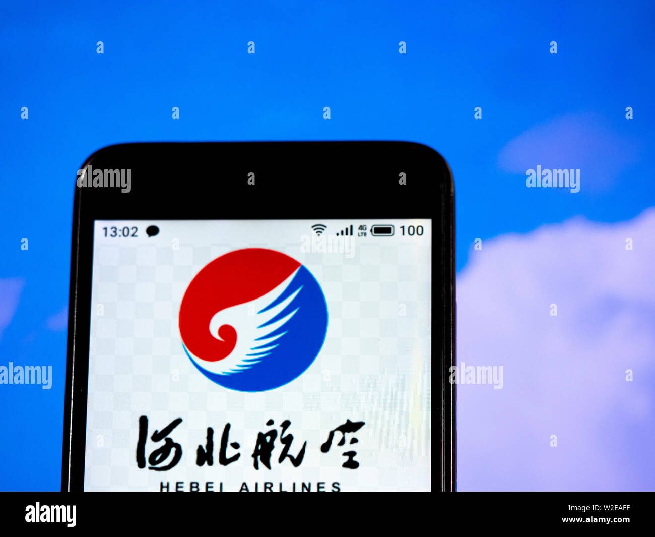 In this photo illustration the Hebei Airlines logo is seen displayed on ...