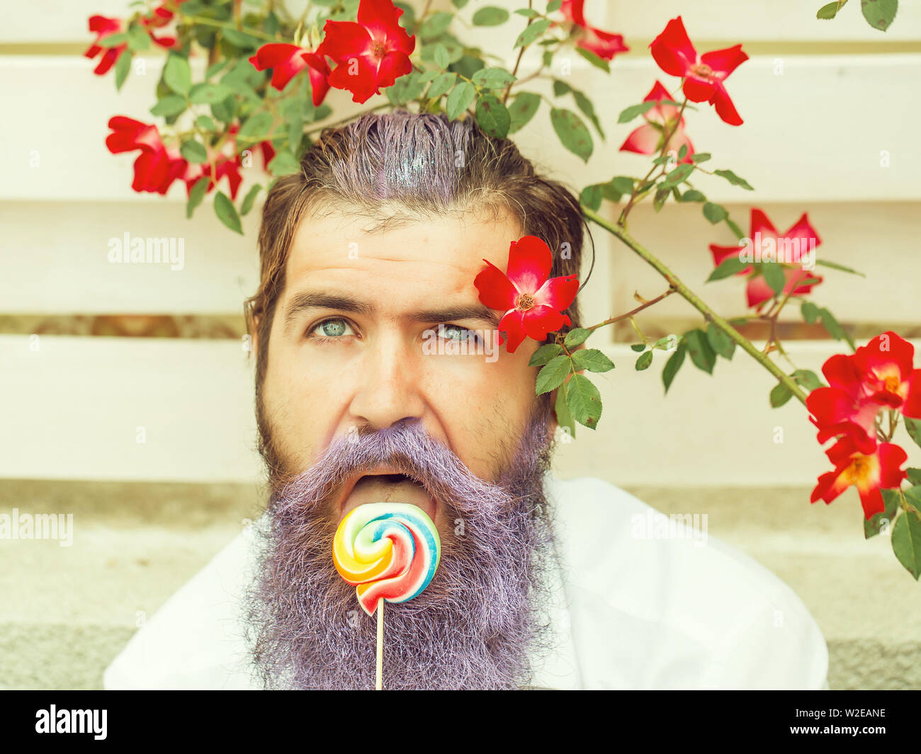 young handsome bearded man with long beard blue color and emotional ...