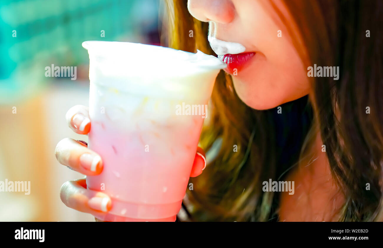 Pastel shades Pink milk with whipping cream Stock Photo - Alamy