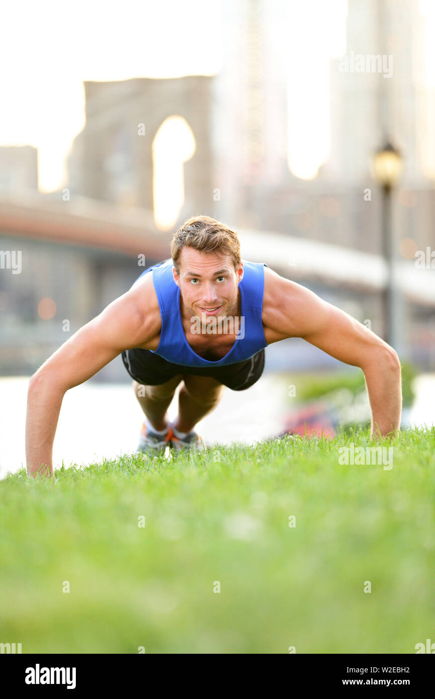 Push-ups - man training in New York City, Brooklyn. Male fitness ...